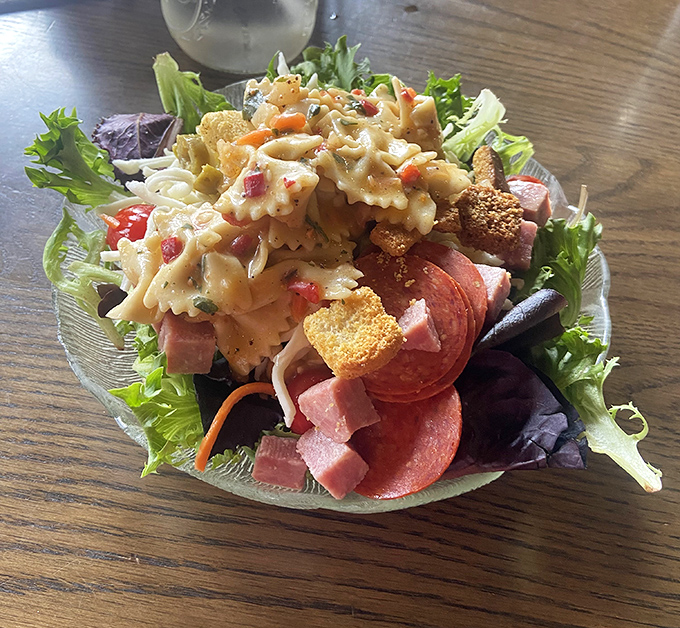 Fresh greens topped with pasta salad, meats, and all the fixings&mdash;this isn't a side salad, it's a full production.