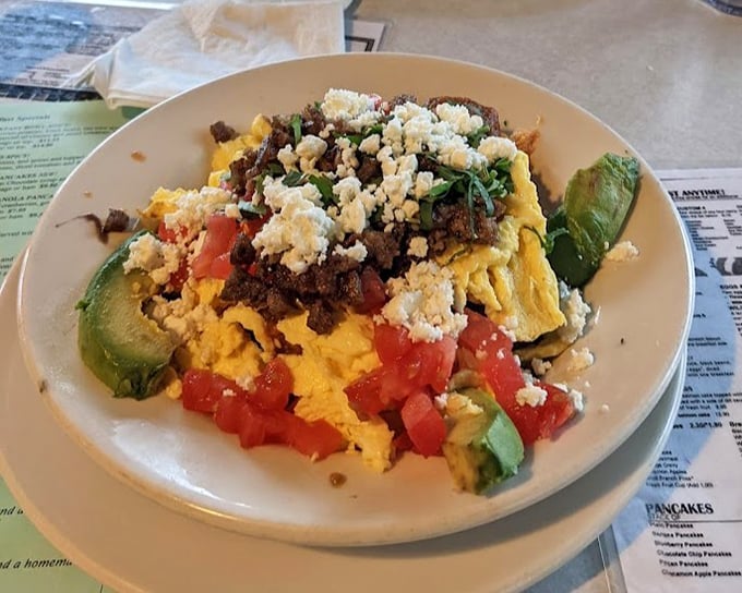Breakfast geography at its finest&mdash;mountains of eggs, valleys of avocado, and a sea of flavors that'll make your taste buds want to explore.