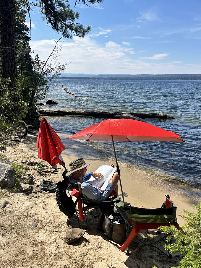 The perfect reading nook doesn't exi&mdash; Oh wait, here it is. A good book, lake views, and an umbrella for optimists in the Northwest.