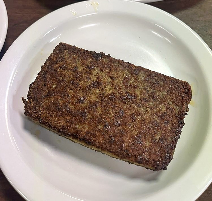 Scrapple: Delaware's contribution to breakfast culture that divides families but unites the faithful. A crispy slab of regional pride.