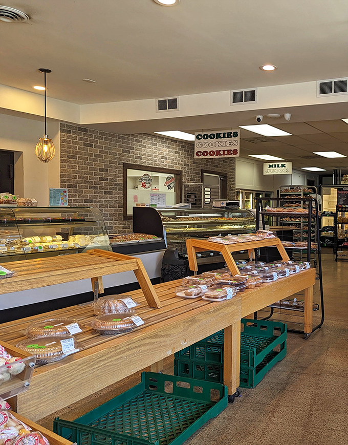 Wooden displays hold treats at perfect browsing height, making impulse purchases not just easy but practically inevitable and completely justified.