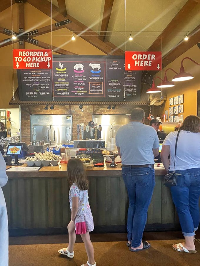 The counter experience: where decisions are made, anticipation builds, and the aroma of smoked meats makes waiting a pleasure.