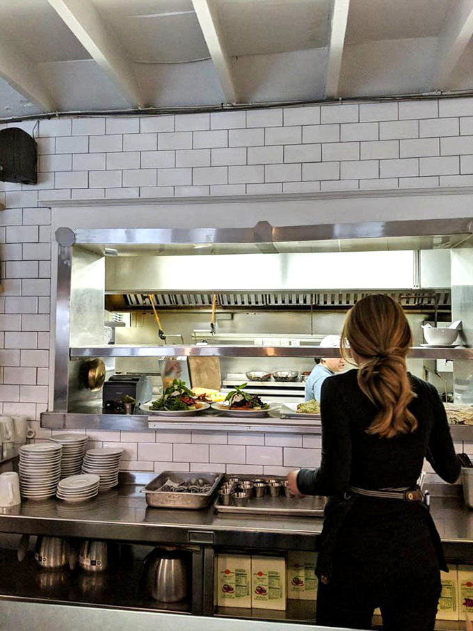 The kitchen pass where plated masterpieces await their journey to hungry patrons. Every great breakfast has a story, and it begins right here.