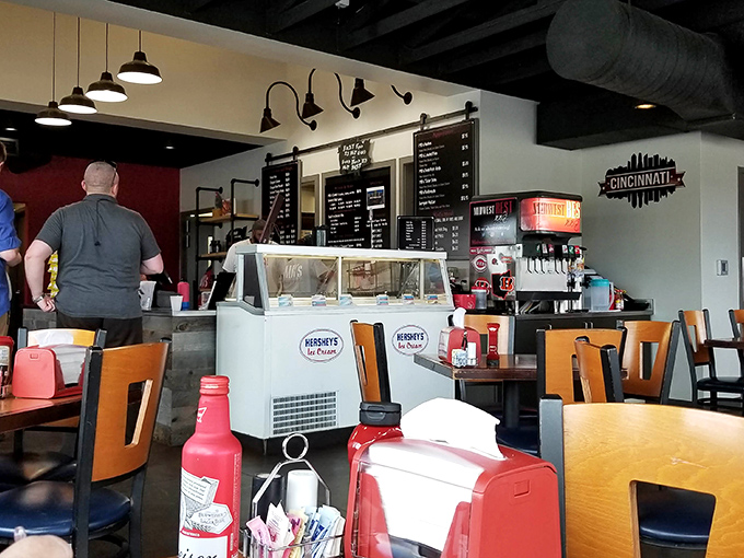 The Cincinnati skyline silhouette watches over diners like a proud parent&mdash;local pride served alongside smoky delights.