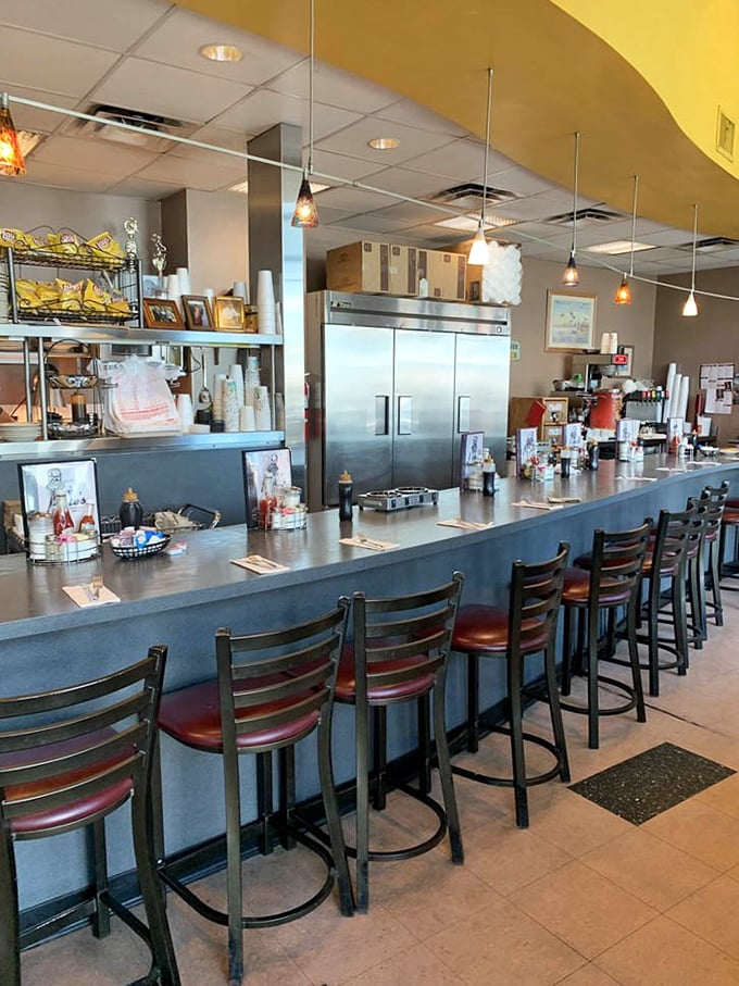 The counter stretches like a runway for breakfast dreams, each stool an invitation to join the community of satisfied diners.