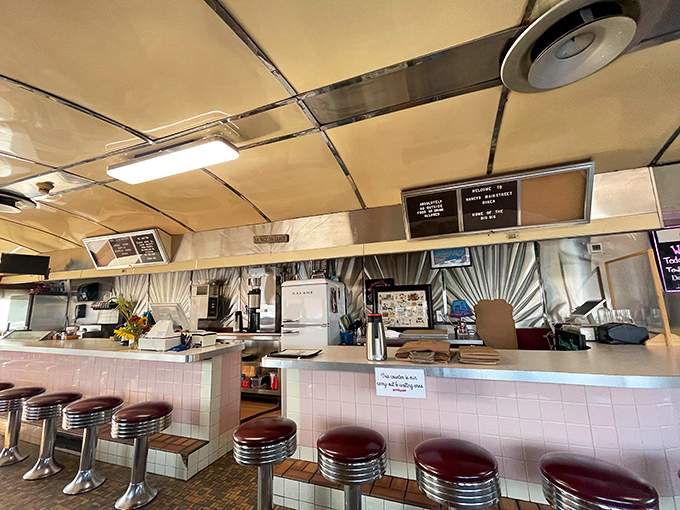 The heart of the diner operation &ndash; where orders are called, coffee is poured, and the symphony of comfort food is conducted with practiced precision.