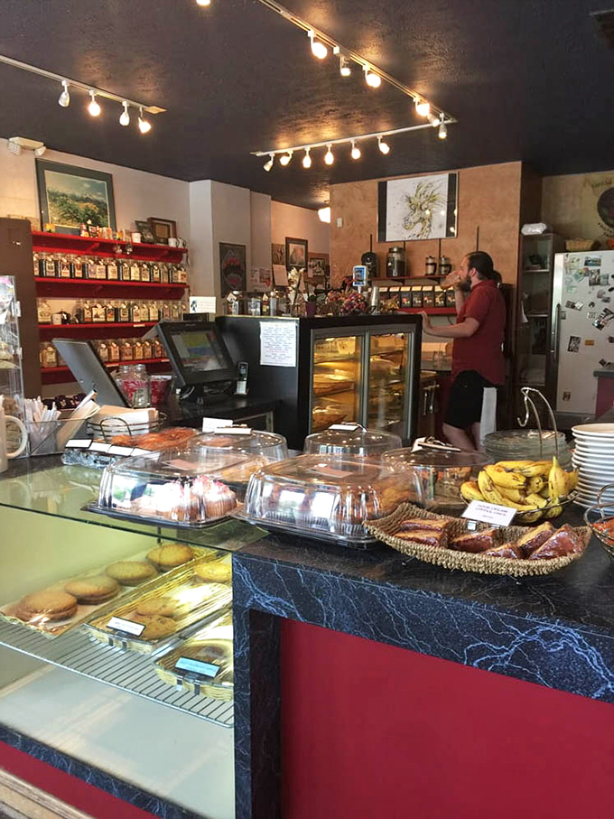 The counter offers a front-row seat to the daily performance of pastry artistry and coffee craftsmanship.