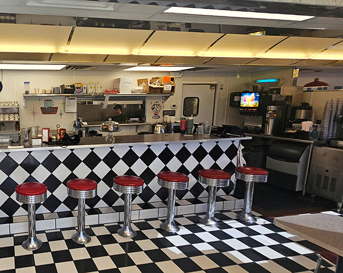 The curved ceiling and bustling counter create that perfect diner energy where strangers become temporary friends united by hunger.