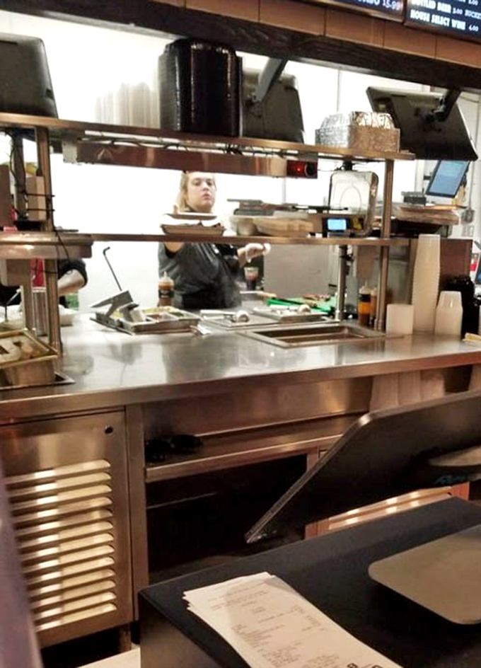 The kitchen line isn't just where orders are prepared—it's where barbecue dreams materialize before your very eyes.