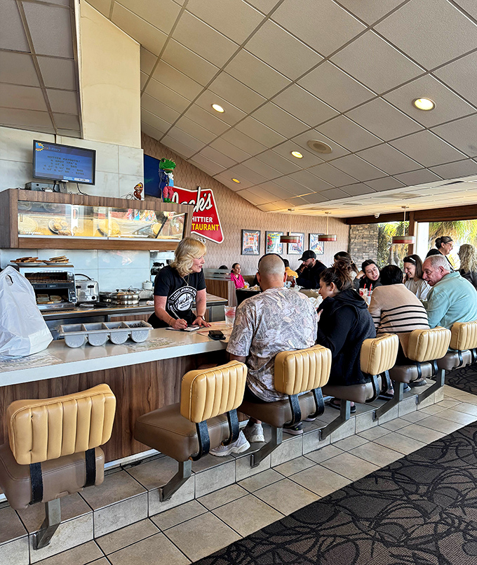 Morning rhythms at the counter&mdash;coffee poured, orders called, and the beautiful choreography of a diner that knows its purpose.