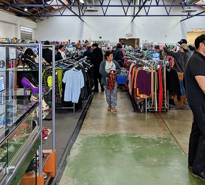 The thrill of the hunt in action. Like food market regulars eyeing the freshest catch, these shoppers know timing is everything.