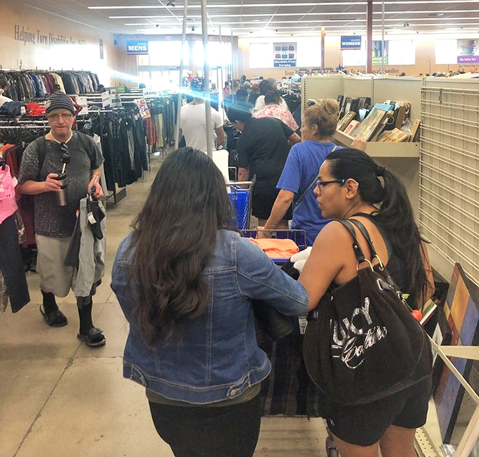 The thrill of the hunt! Shoppers navigate the aisles with the focus of archaeologists discovering ancient civilizations.