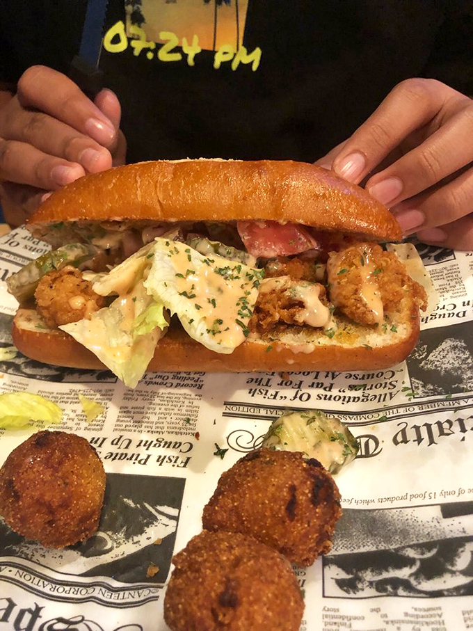 The Shrimp Po' Boy comes loaded with crispy shrimp, fresh veggies, and sauce on a toasted roll&mdash;New Orleans would give its blessing.