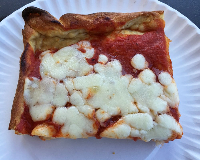 The square slice &ndash; a thick, pillowy base supporting a perfect ratio of sauce to cheese. Architectural integrity you can taste.