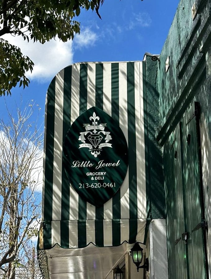 The Little Jewel's elegant signage promises treasures within&mdash;a fleur-de-lis emblem standing guard over authentic Cajun delights in the heart of Los Angeles.