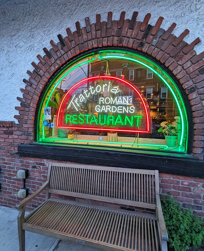The neon sign glows like a beacon in the night, guiding hungry souls to their pasta salvation on Cleveland's Little Italy strip.