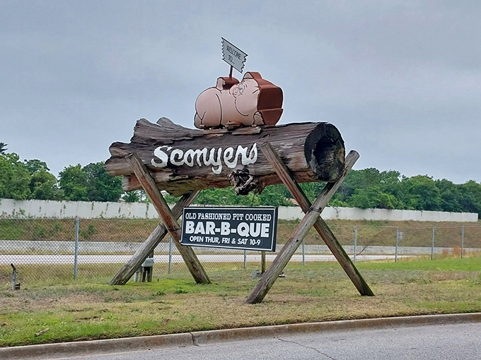 This roadside sign featuring a happy pig is the barbecue equivalent of a lighthouse – guiding hungry travelers to smoky salvation.