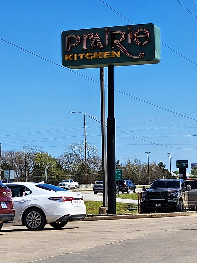 The Prairie Kitchen sign stands tall against the Oklahoma sky, a North Star for those navigating the wilderness of hunger.