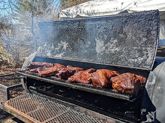 Where the magic begins&mdash;meat meeting smoke in the great outdoors. This weathered smoker has stories to tell, all of them delicious.