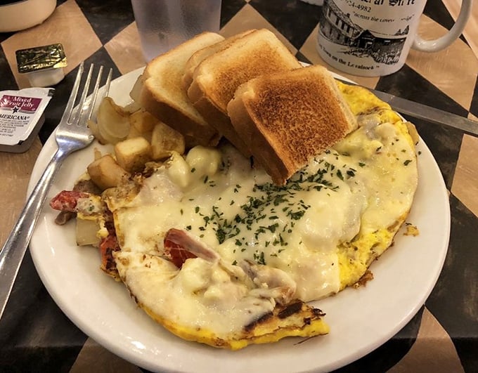 Breakfast that doesn't understand the concept of "too much cheese." The toast stands by, ready for its supporting role in the egg symphony.