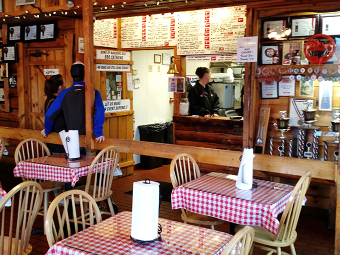 The staff keeps the barbecue flowing with the efficiency of people who know they're providing an essential public service.