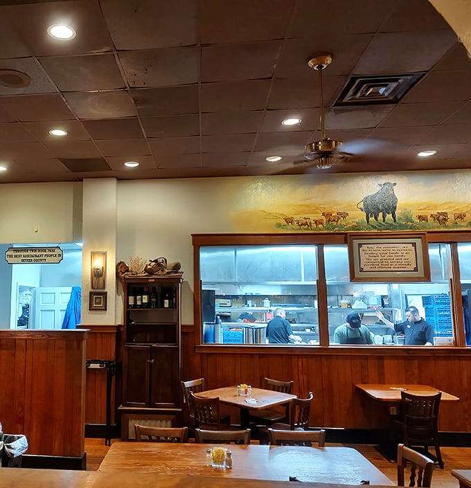 A mural of grazing cattle above the kitchen window serves as both decoration and a gentle reminder of where your dinner originated.