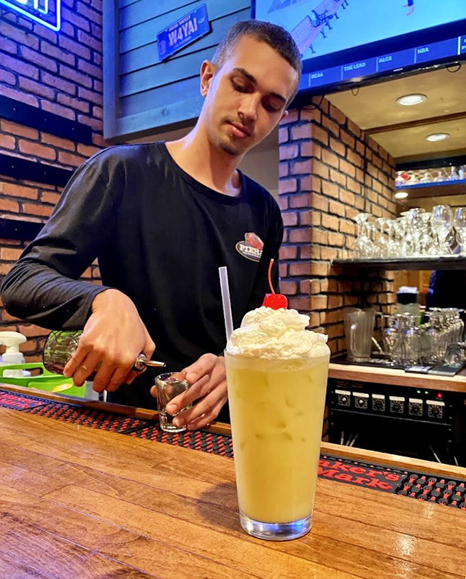 Behind every great dessert is someone crafting it with care &ndash; this towering whipped cream creation promises a sweet finale.