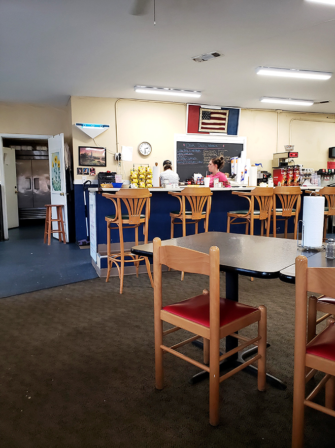 The counter and dining area where breakfast dreams come true, complete with the American flag watching over morning rituals.