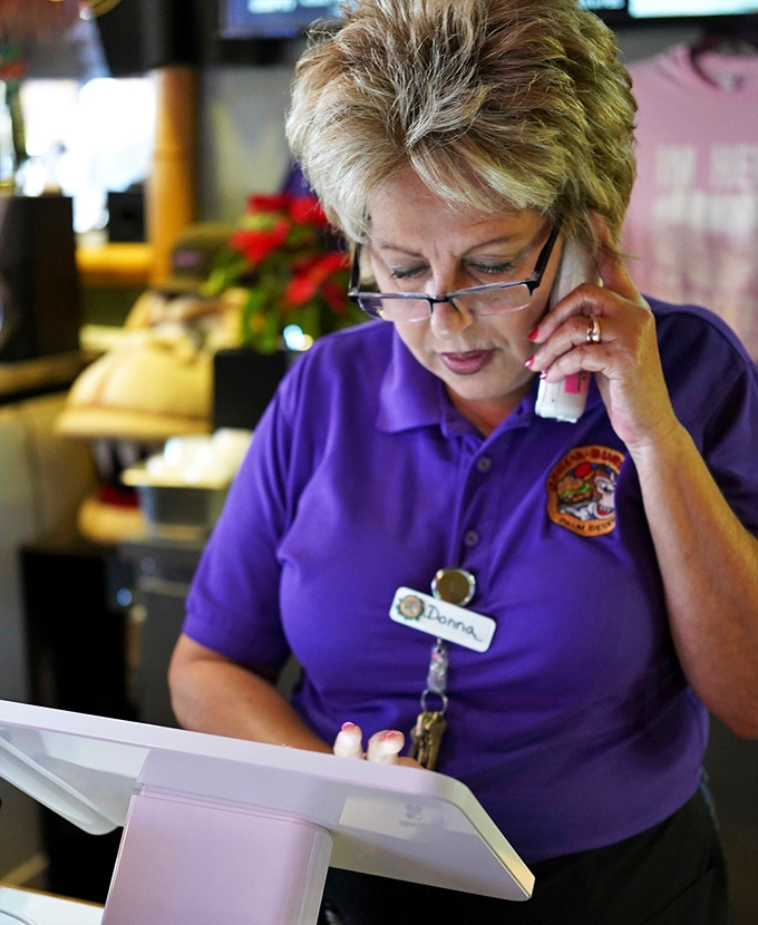 The unsung heroes of burger perfection, taking orders with the precision of a NASA launch coordinator.
