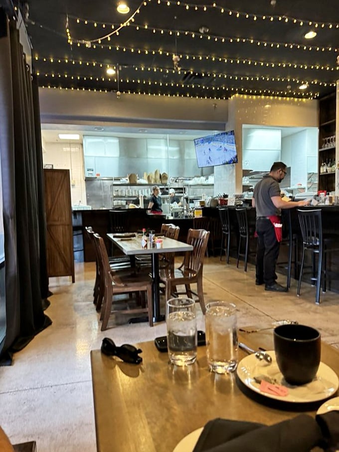 Where the magic happens. String lights twinkle above as the kitchen crew orchestrates seafood symphonies that keep locals coming back for encores.