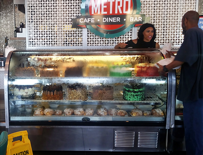 Where food meets friendly service under the watchful eye of the Metro sign. The display case showcases desserts that make dieting seem like a terrible idea.