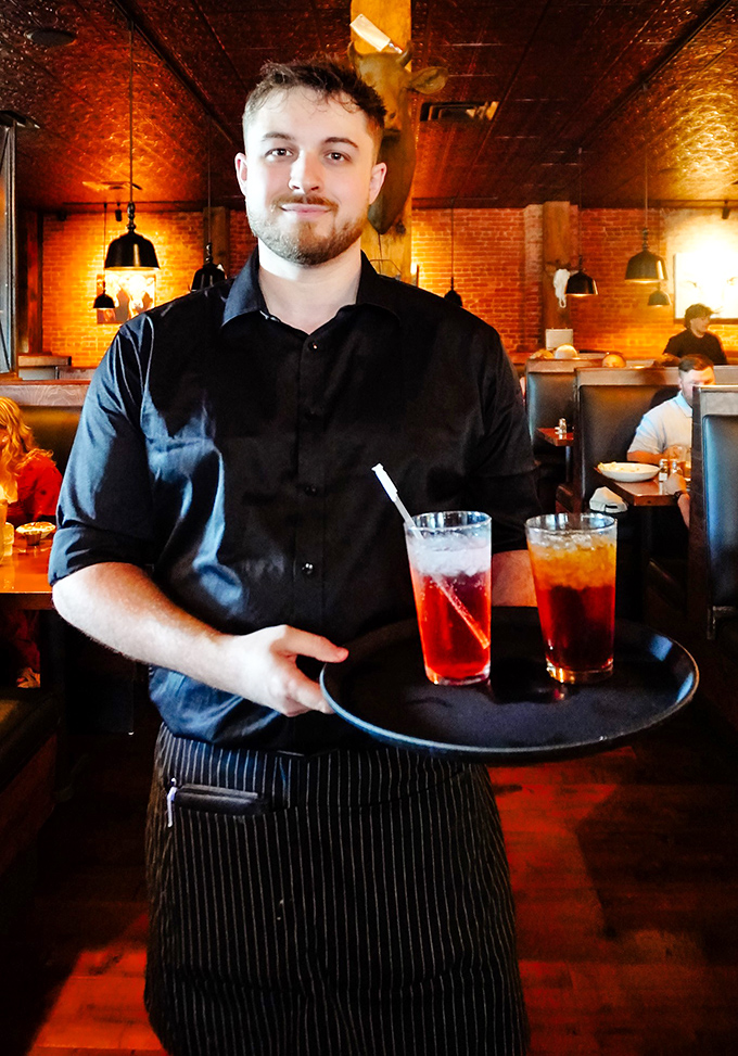 The staff moves through the dining room like a well-rehearsed ballet, if ballet involved carrying perfectly cooked steaks.