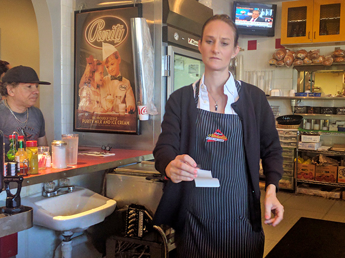 The staff moves with purpose and precision, turning orders into edible masterpieces with the efficiency of backstage hands at the Grand Ole Opry.