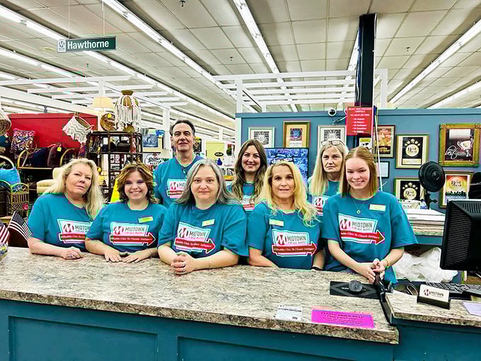 The friendly faces behind the market's magic. Their matching shirts suggest they're serious about helping you find your perfect treasure.