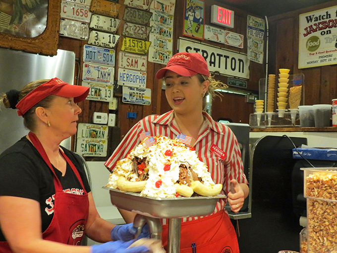 The red-striped uniforms aren't just cute&mdash;they're warning signs that your diet is about to face serious temptation. These servers are happiness dealers.