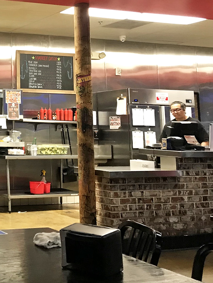 The counter area where market prices are posted and staff prepare your seafood order with practiced efficiency and genuine friendliness.