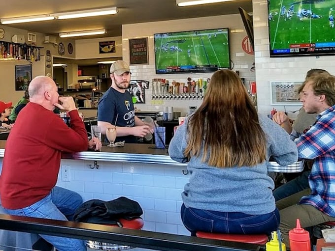 Where strangers become friends over shared opinions about proper burger doneness and the superiority of hand-cut fries.