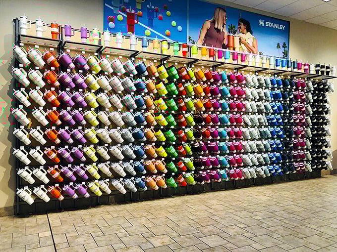 The rainbow wall of Stanley tumblers&mdash;where hydration meets fashion in a dazzling spectrum of color choices.