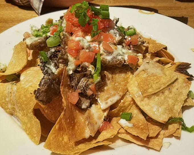Nachos that laugh in the face of minimalism&mdash;a mountain of chips, cheese, steak, and toppings that requires a strategy session before diving in.