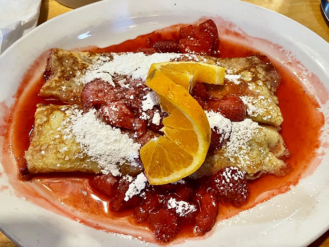 These strawberry crepes don't just satisfy a sweet tooth&mdash;they're like edible sunshine with a powdered sugar snowfall on top.