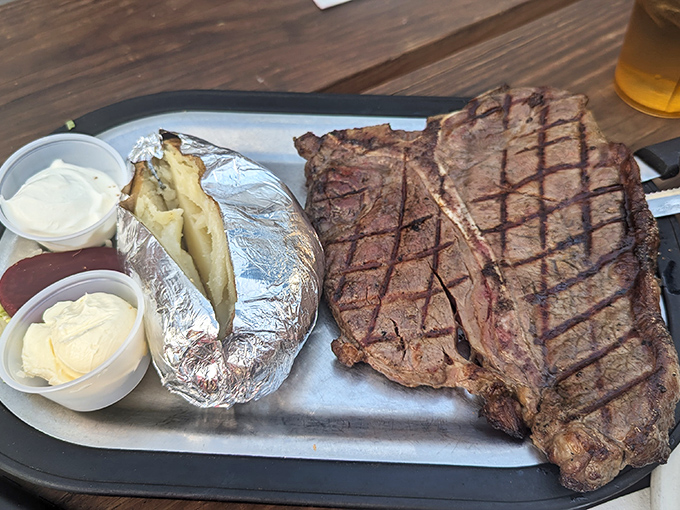 The T-bone steak arrives like the main character in a meat lover's dream, with sides playing respectful supporting roles.