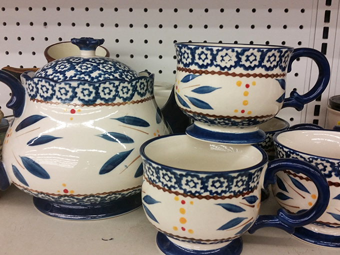 Delicate teapots with intricate patterns tell tales of formal afternoons and cozy mornings, now awaiting their next pouring performance.