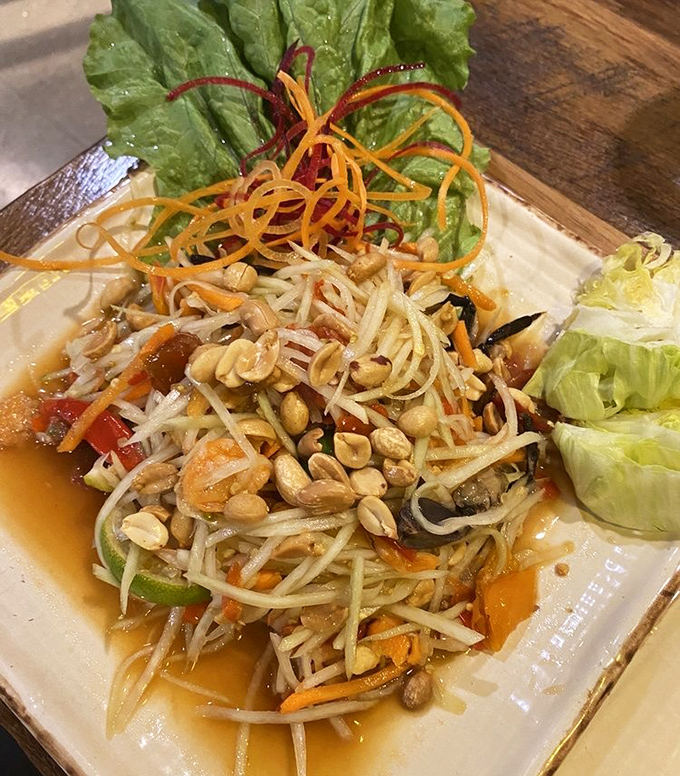 This papaya salad isn't just food&mdash;it's a textural symphony of crunch, tang, and spice that makes your fork do a happy dance.
