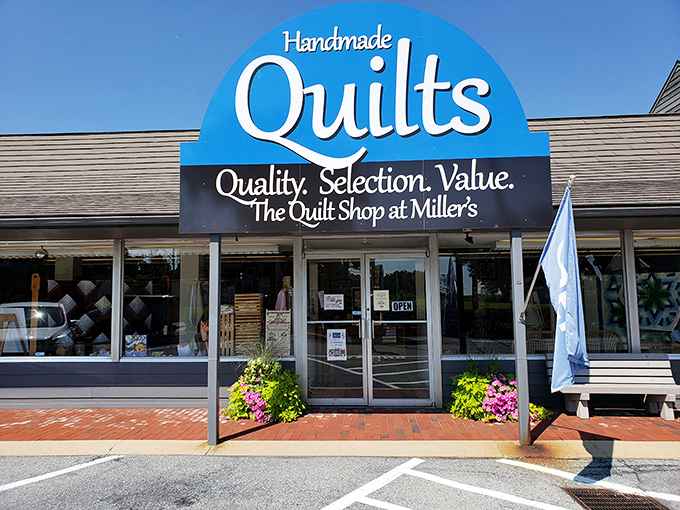 Behind this unassuming storefront lies a kaleidoscope of handcrafted quilts, each representing hundreds of hours of meticulous artistry.