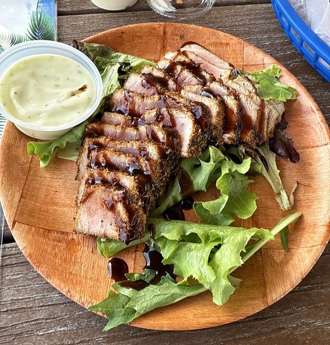 This seared tuna doesn't just sit on the plate—it poses, knowing full well it's about to star in your vacation highlight reel.