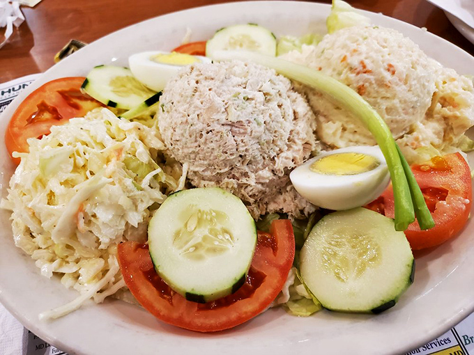 Tuna salad elevated beyond brown bag status &ndash; a garden of fresh vegetables surrounding creamy scoops that would make your grandmother nod approvingly.