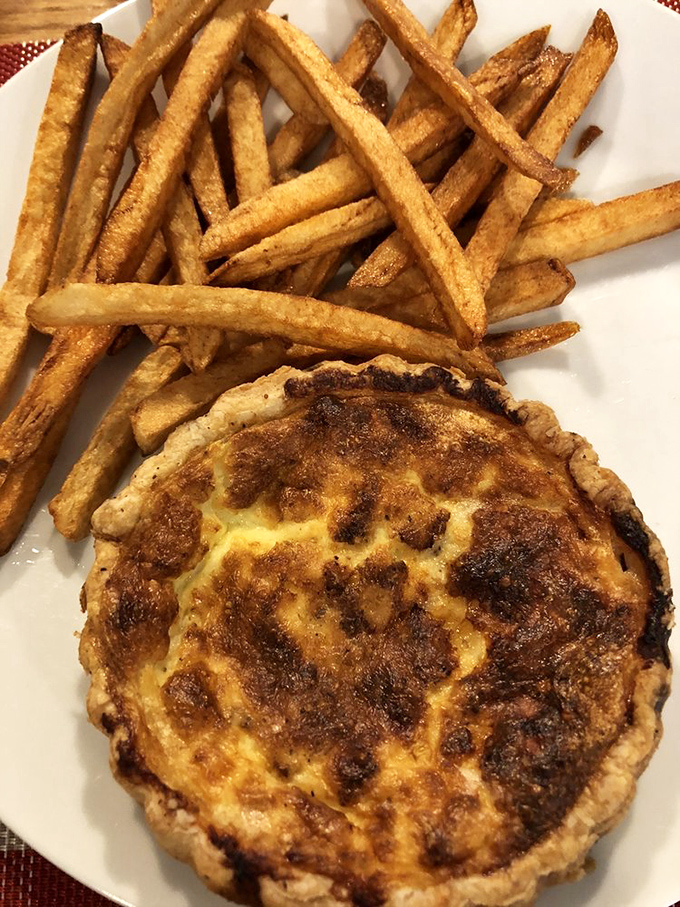 This quiche and fries combo proves that comfort food transcends borders. The golden-brown crust promises buttery flakiness with each bite.