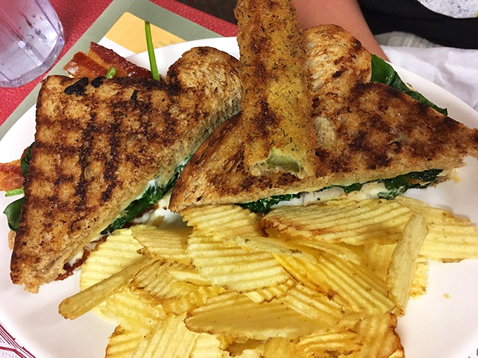 Perfectly grilled bread reveals a garden of ingredients inside—proof that sandwiches can be both comforting and sophisticated when done right.