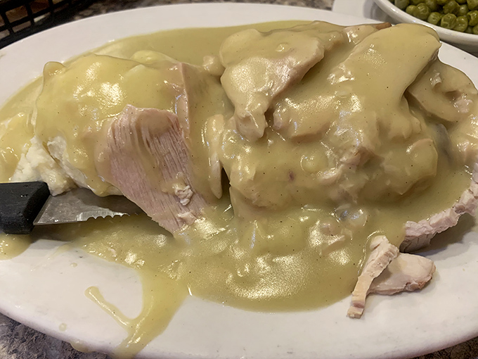 Turkey dinner with gravy cascading like a savory waterfall&mdash;Thanksgiving doesn't have to wait for November at Middlesex Diner.