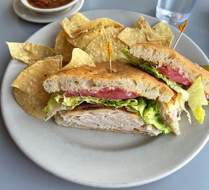 The club sandwich &ndash; not just stacked but architecturally sound, with crisp lettuce, juicy tomato, and turkey that wasn't just waved over a flame.